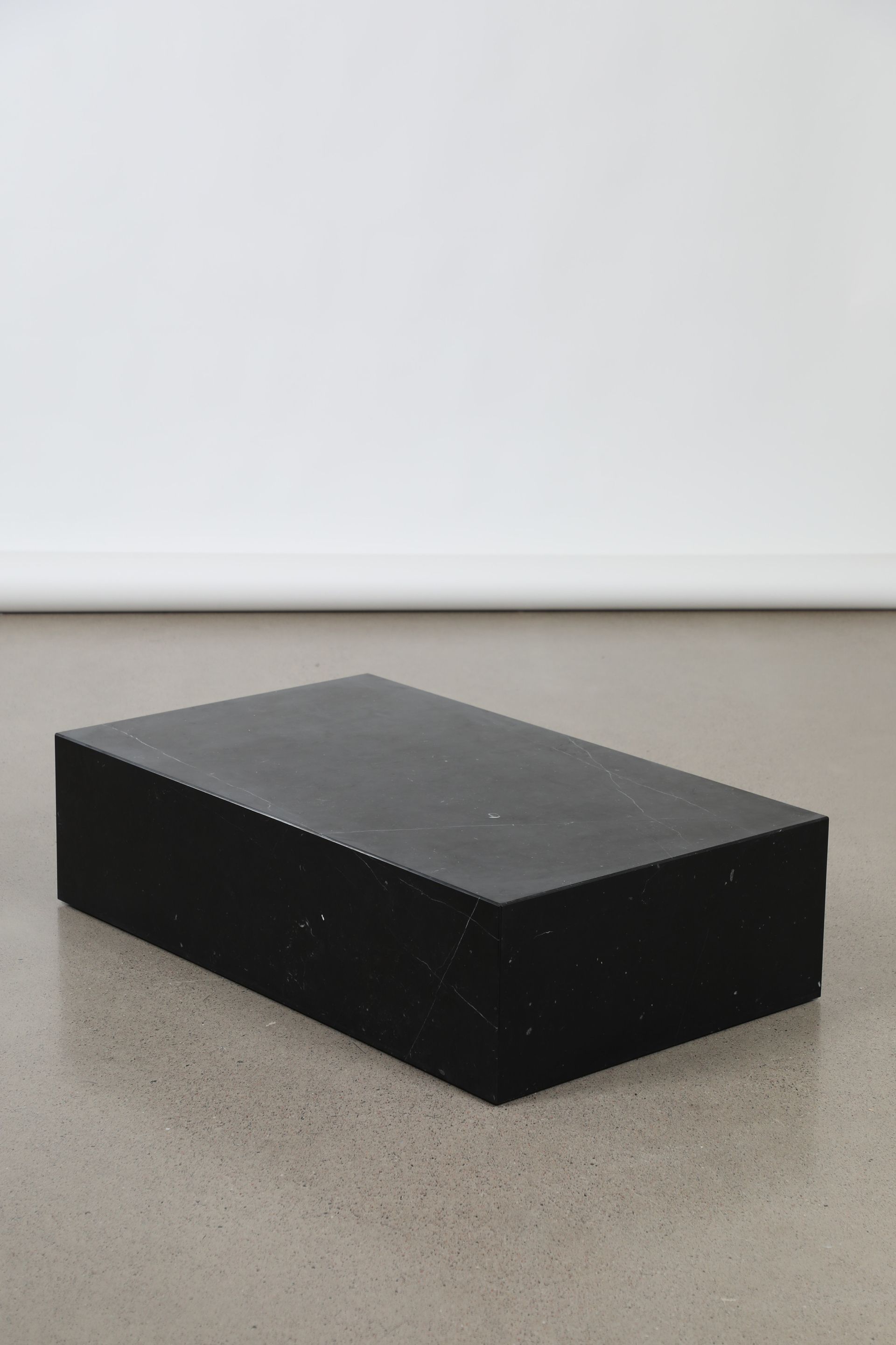 Plinth table, low, black Marquina marble | Franckly